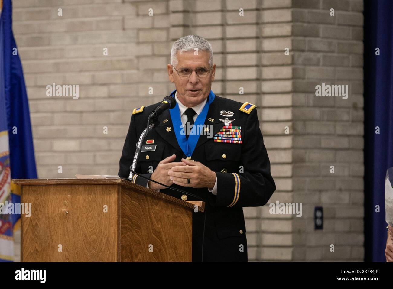 Chief Warrant Officer 5 (Ret.) Peter T. Panos addresses the crowd ...
