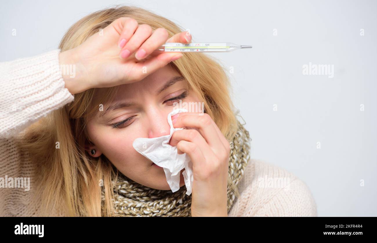 Girl sick hold thermometer and tissue. Measure temperature. Break fever ...