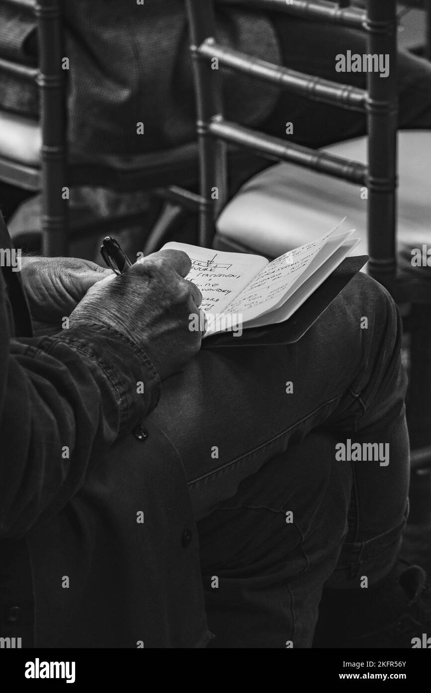 Business man writing notebook Black and White Stock Photos & Images - Alamy