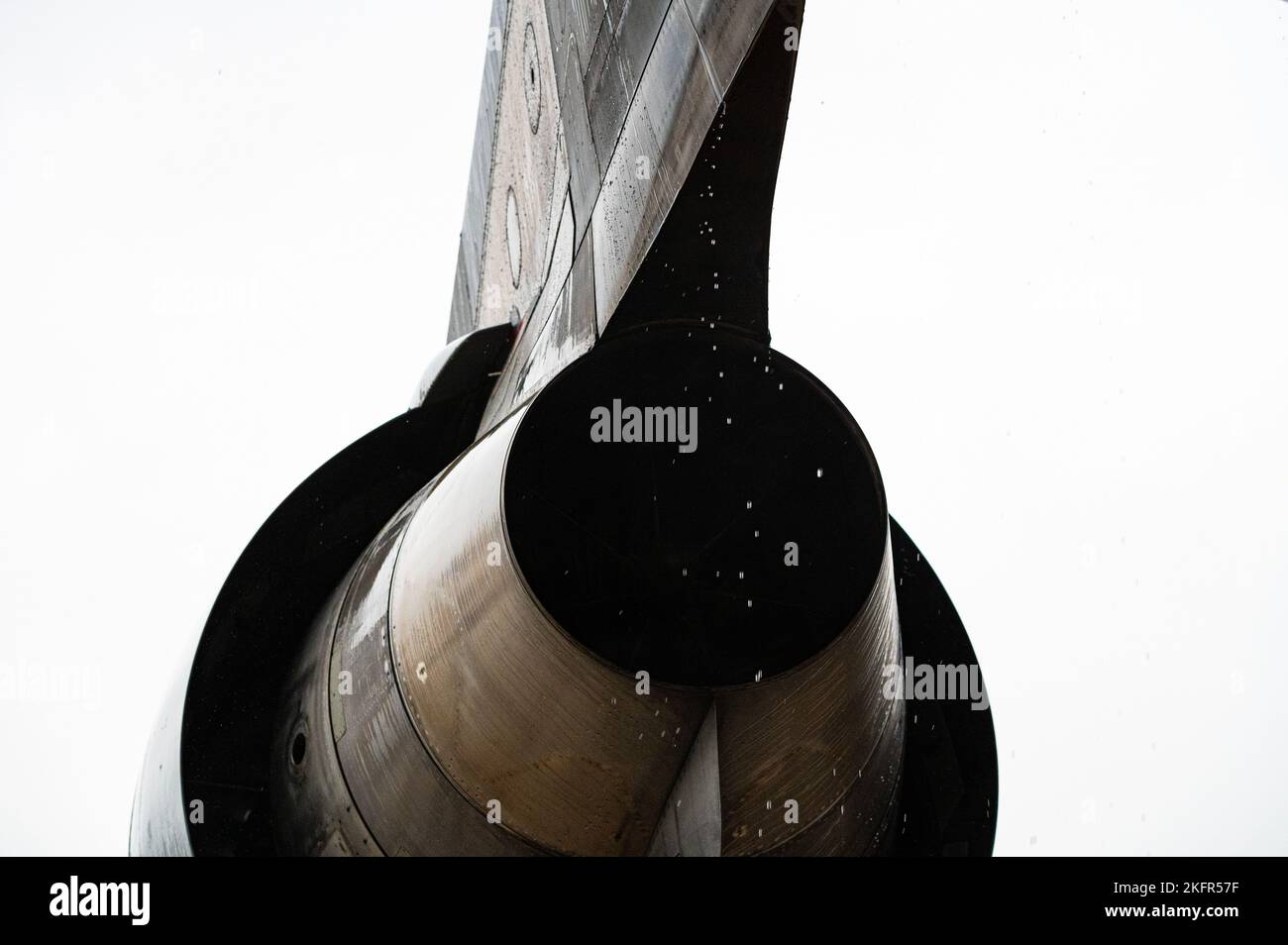 Rain drips from a C-17 Globemaster III engine pylon and tail cone at ...