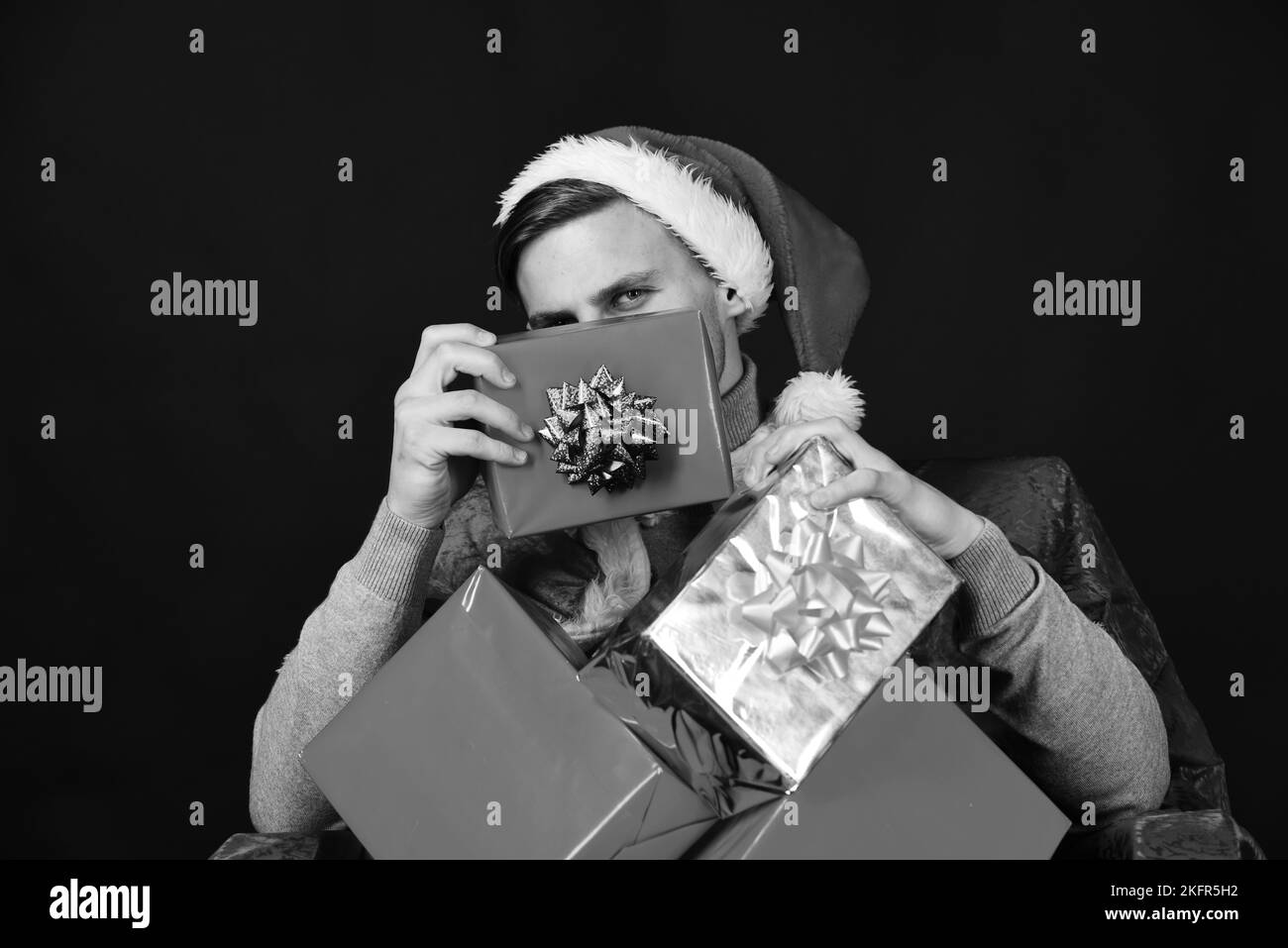 Wrapped christmas gift with red ribbon Black and White Stock Photos ...