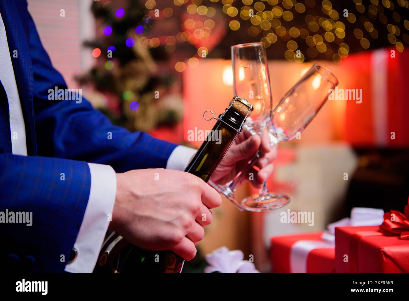 Open champagne and celebrate holiday. Celebrate new year with champagne ...