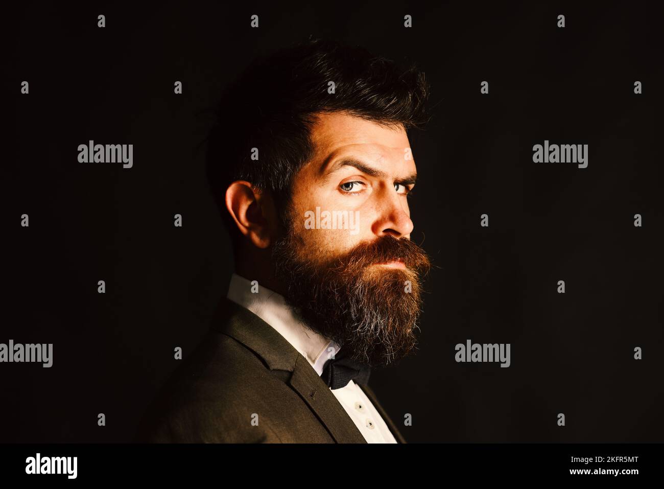 Businessman with tricky face looks from aside. Man in suit Stock Photo ...