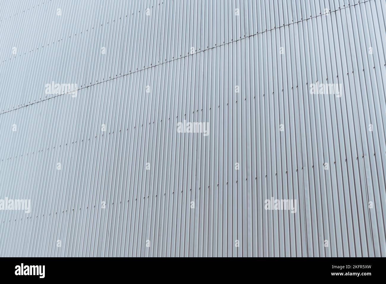 A perspective view of a texture of a white metallic corrugated building ...