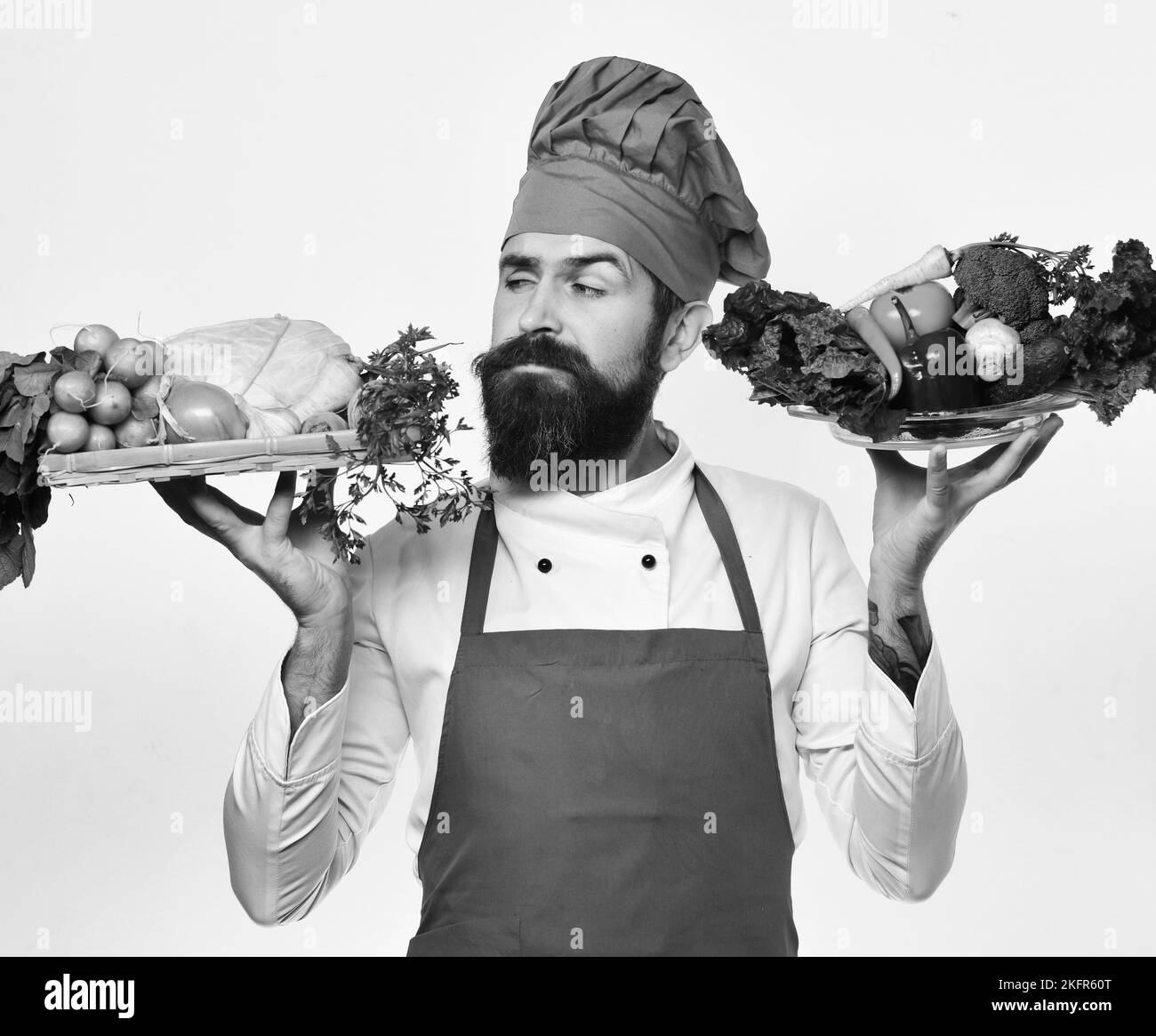 Cooking and vegetarian diet concept. Man with beard Stock Photo - Alamy