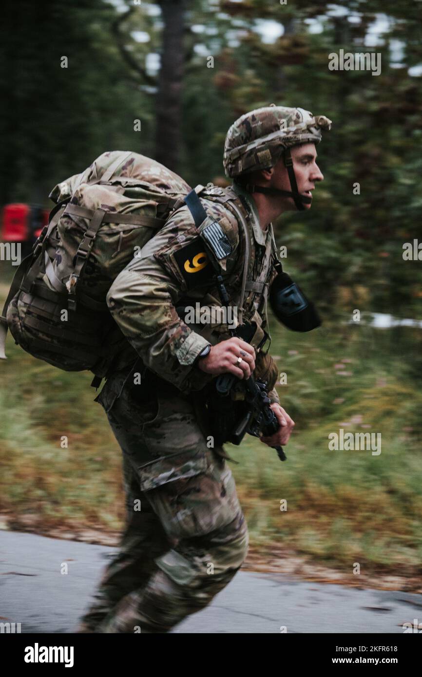 Sgt. Garrett Paulson, representing the U.S. Army Medical Command, runs ...