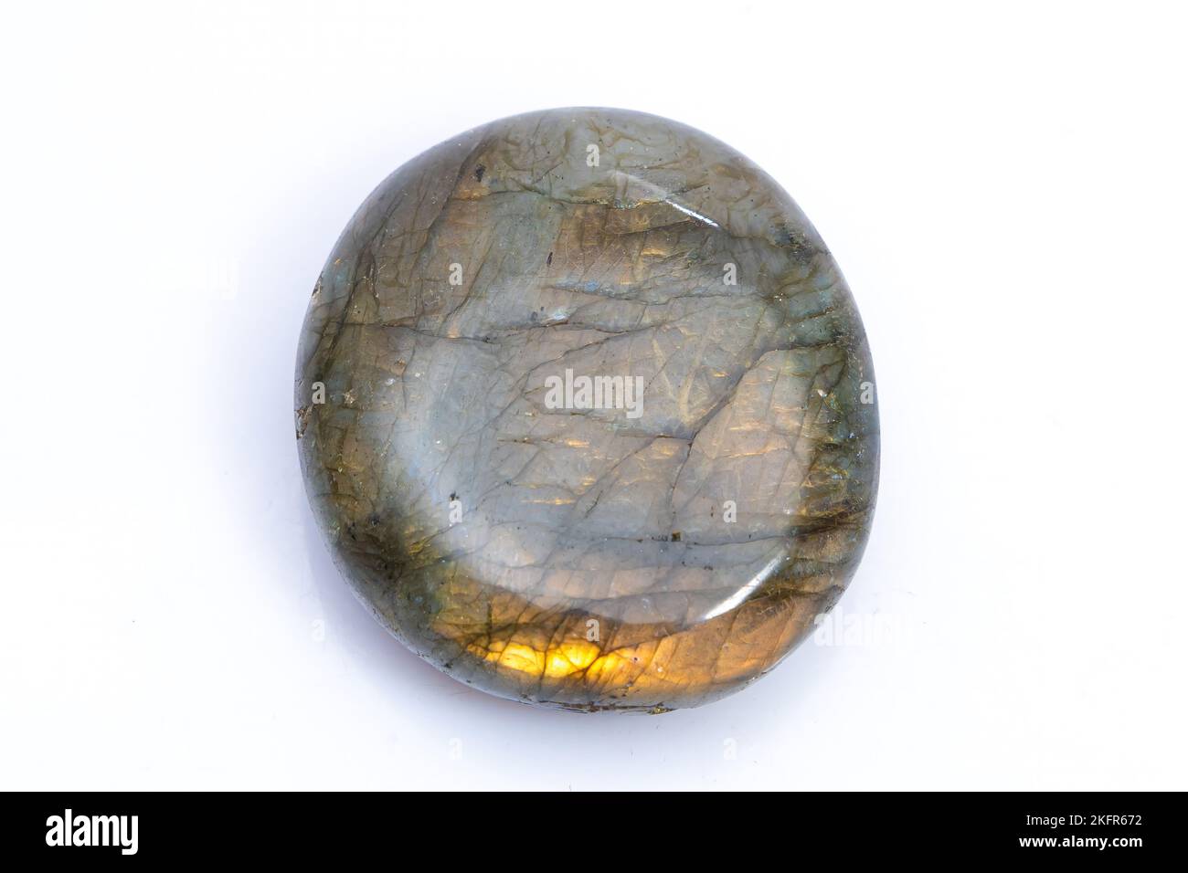 Natural gemstone labradorite isolated on white background. Dark gray ...