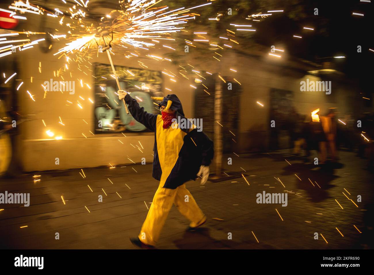 Barcelona, Spain. 19th Nov, 2022. A ‘Correfoc' (fire runner) sets off ...