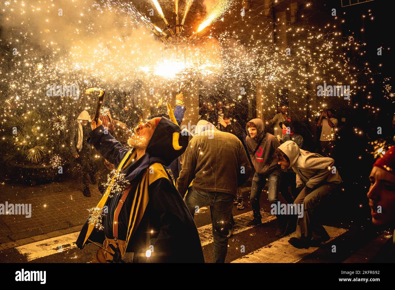 Barcelona, Spain. 19th Nov, 2022. A ‘Correfoc' (fire runner) sets off ...