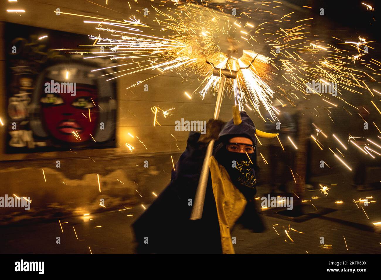 Barcelona, Spain. 19th Nov, 2022. A ‘Correfoc' (fire runner) sets off ...