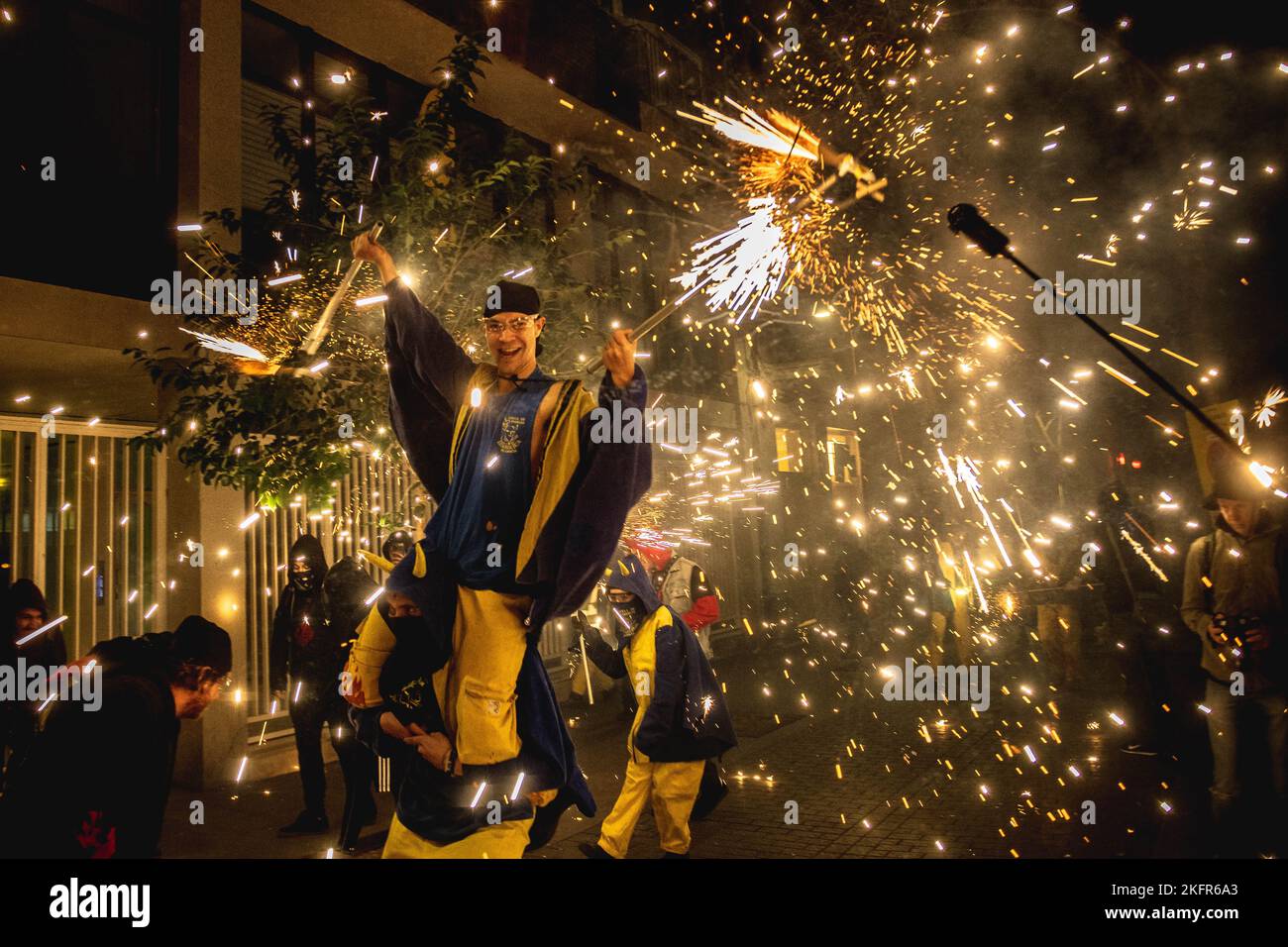 Barcelona, Spain. 19th Nov, 2022. A ‘Correfoc' (fire runner) sets off ...