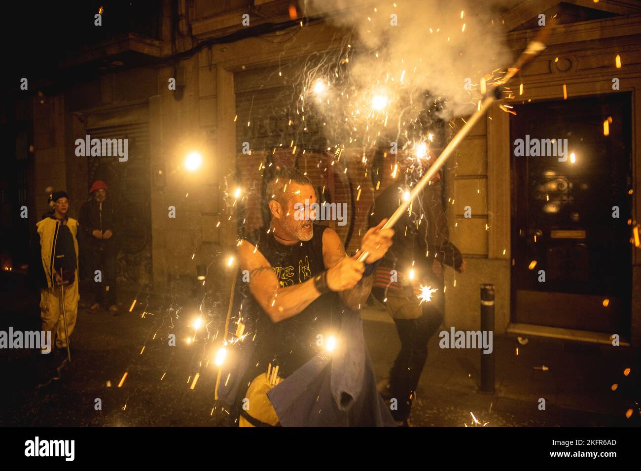 Barcelona, Spain. 19th Nov, 2022. A ‘Correfoc' (fire runner) sets off ...