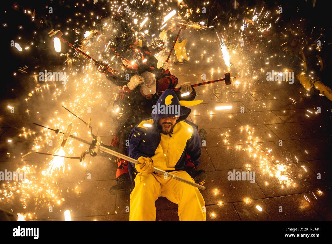 Barcelona, Spain. 19th Nov, 2022. A ‘Correfoc' (fire runner) sets off ...