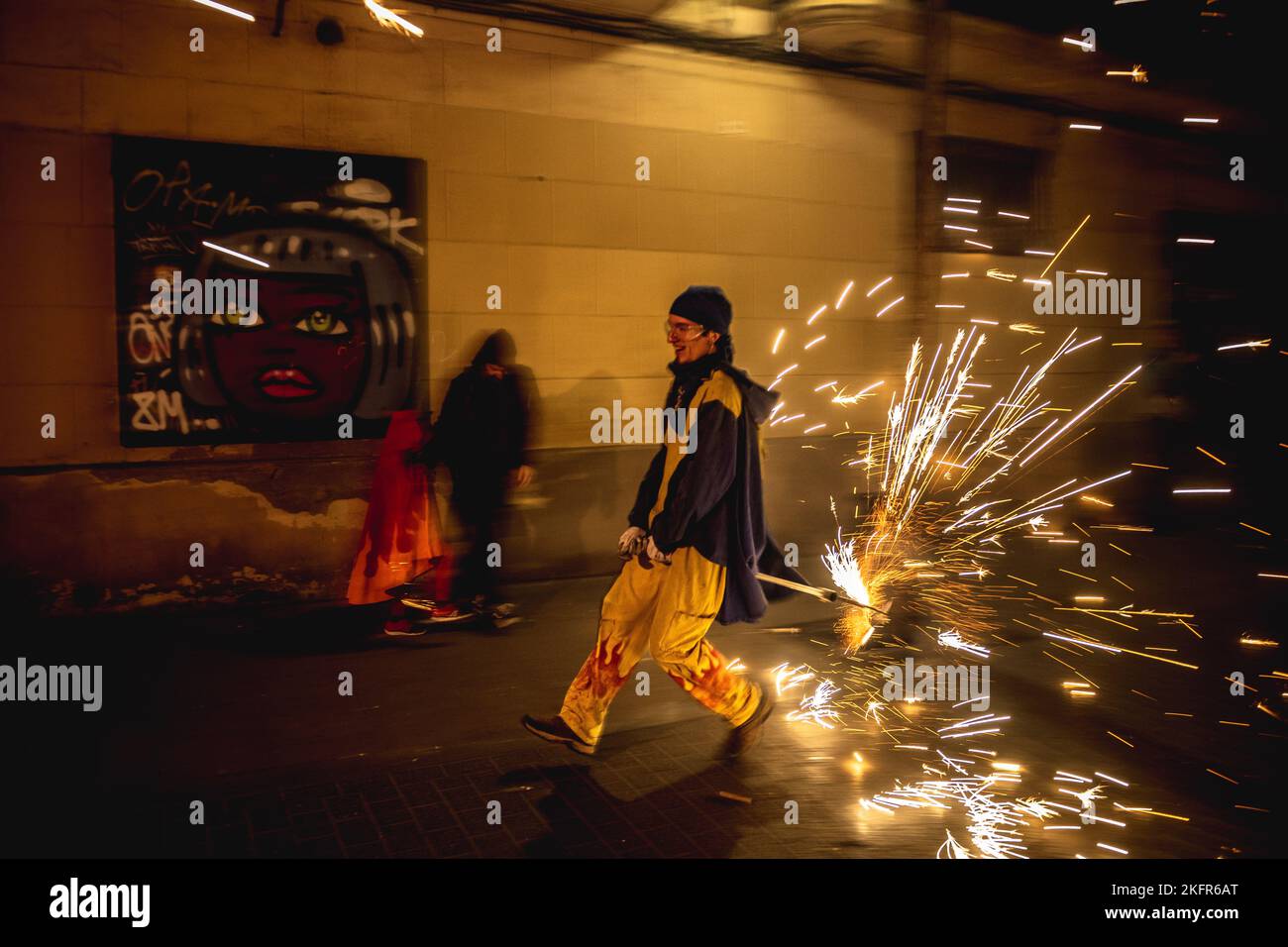 Barcelona, Spain. 19th Nov, 2022. A ‘Correfoc' (fire runner) sets off ...