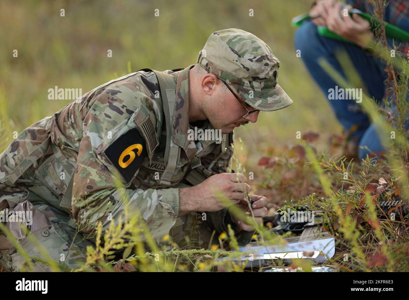 Spc. Wyatt Walls, representing the U.S. Army National Guard, prepares ...