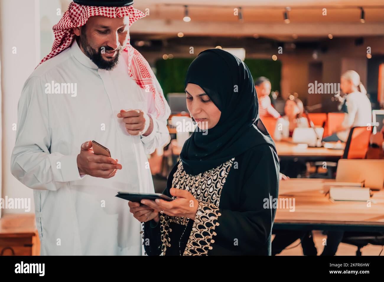 Portrait photo of Arab leader businessman with muslim hijab woman ...