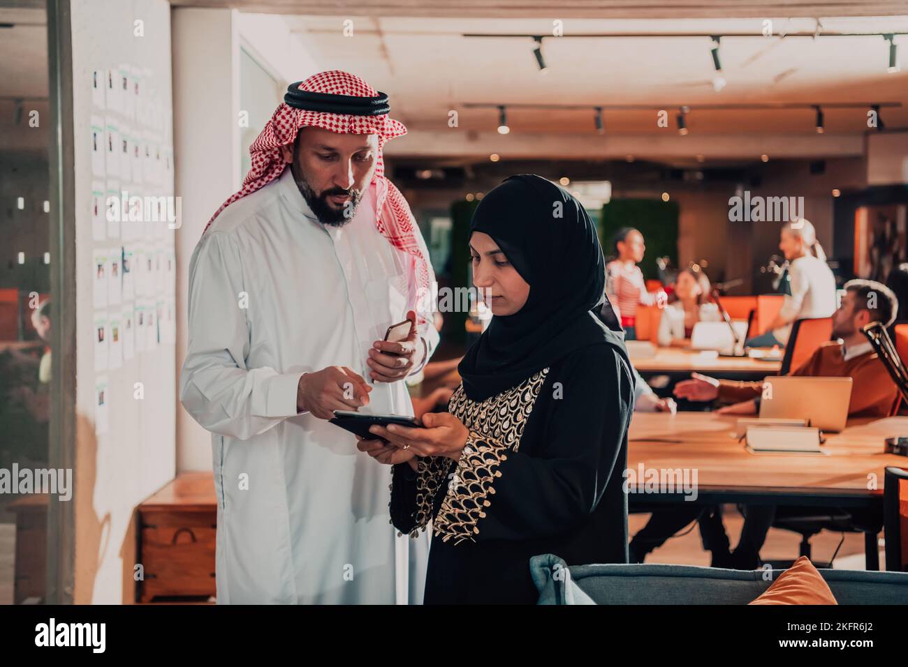 Portrait photo of Arab leader businessman with muslim hijab woman ...