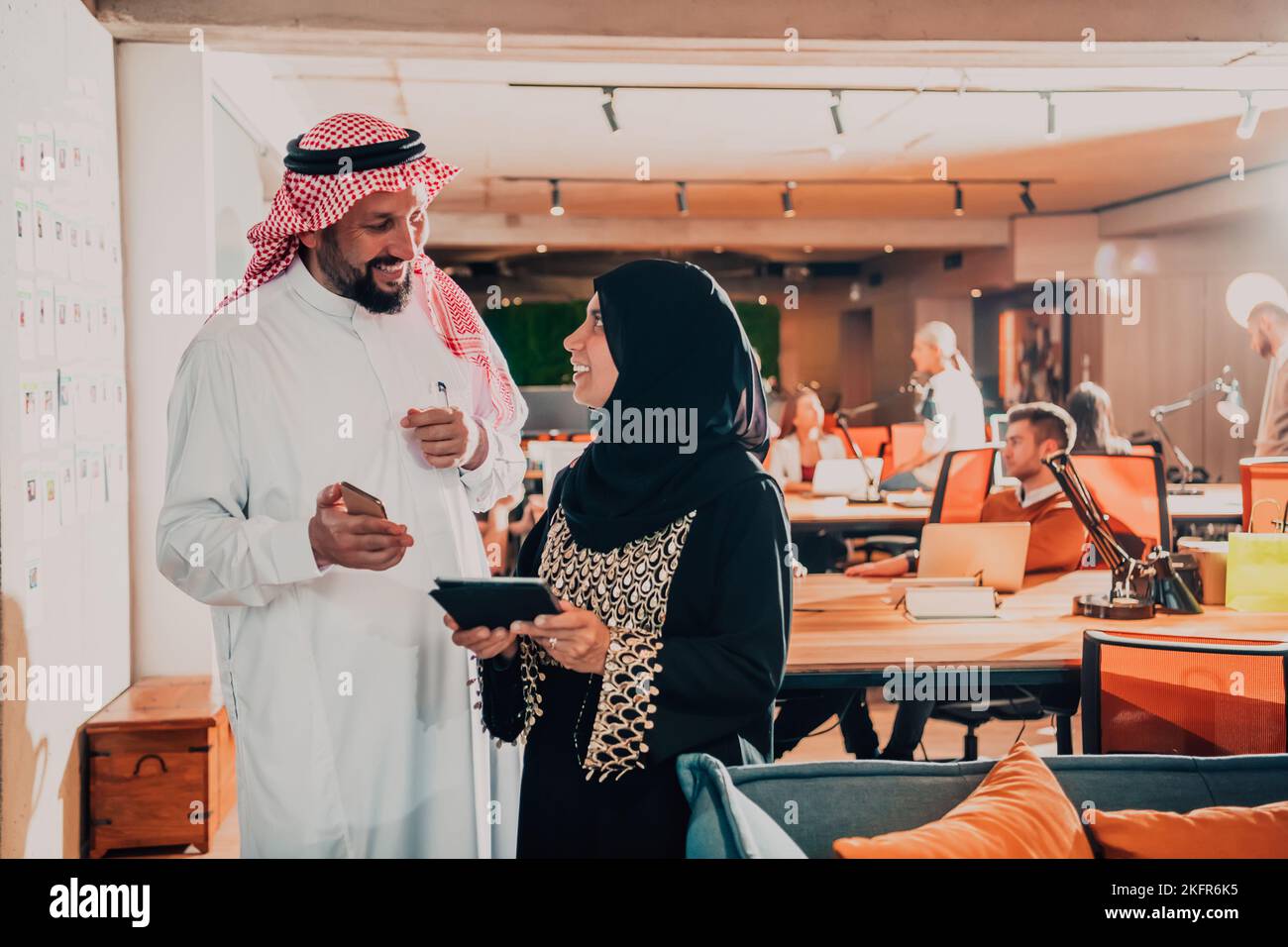 Portrait photo of Arab leader businessman with muslim hijab woman ...