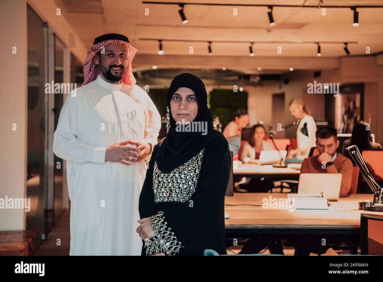 Portrait photo of Arab leader businessman with muslim hijab woman ...