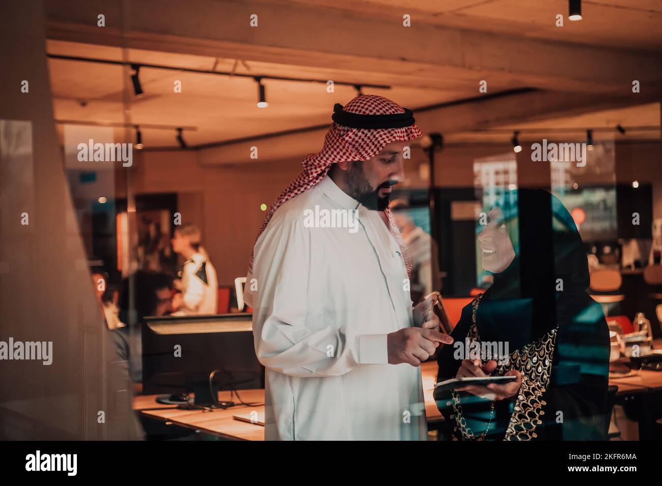 Portrait photo of Arab leader businessman with muslim hijab woman ...