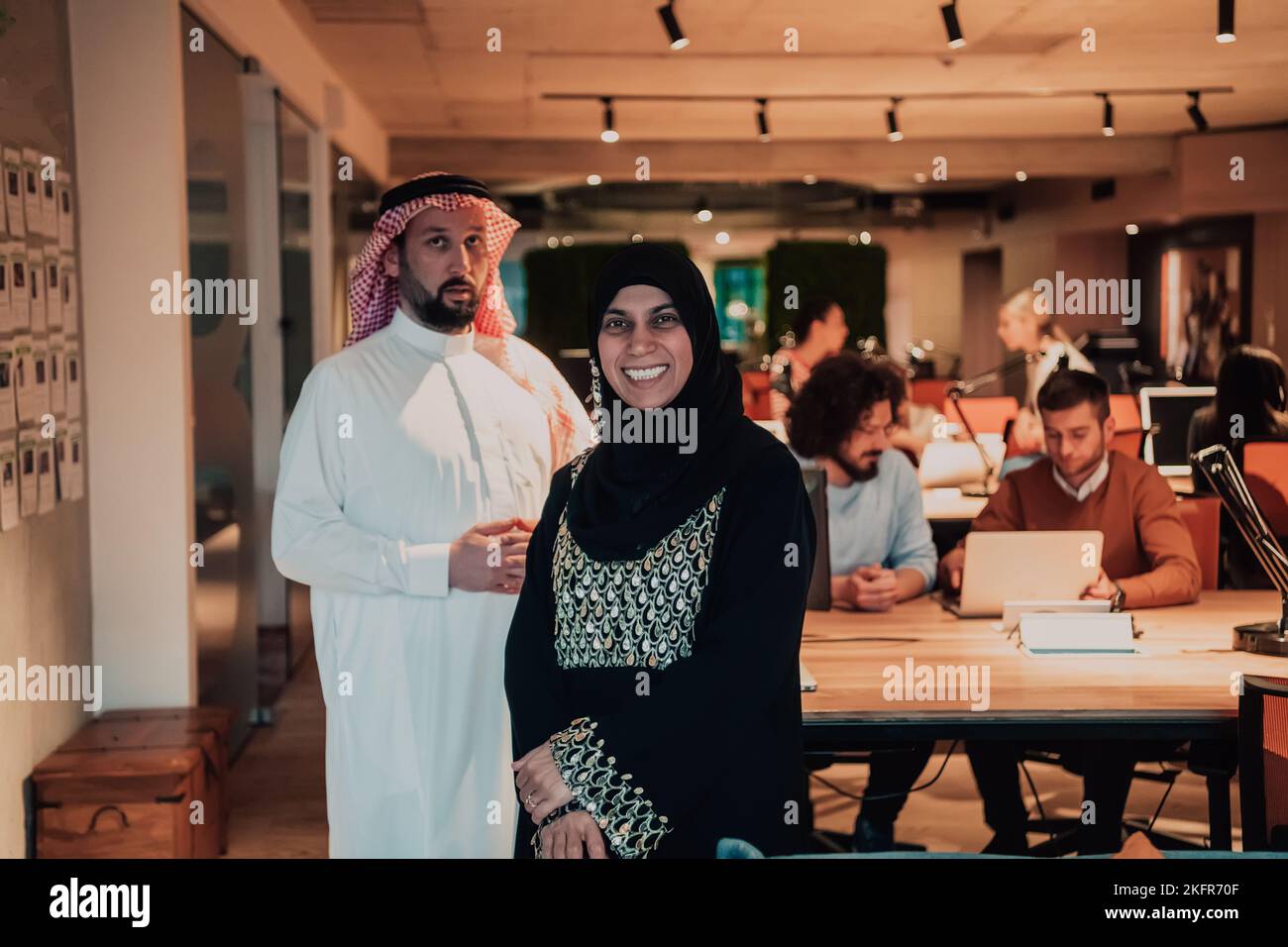 Portrait photo of Arab leader businessman with muslim hijab woman ...
