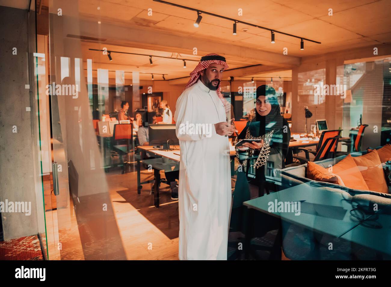 Portrait photo of Arab leader businessman with muslim hijab woman ...