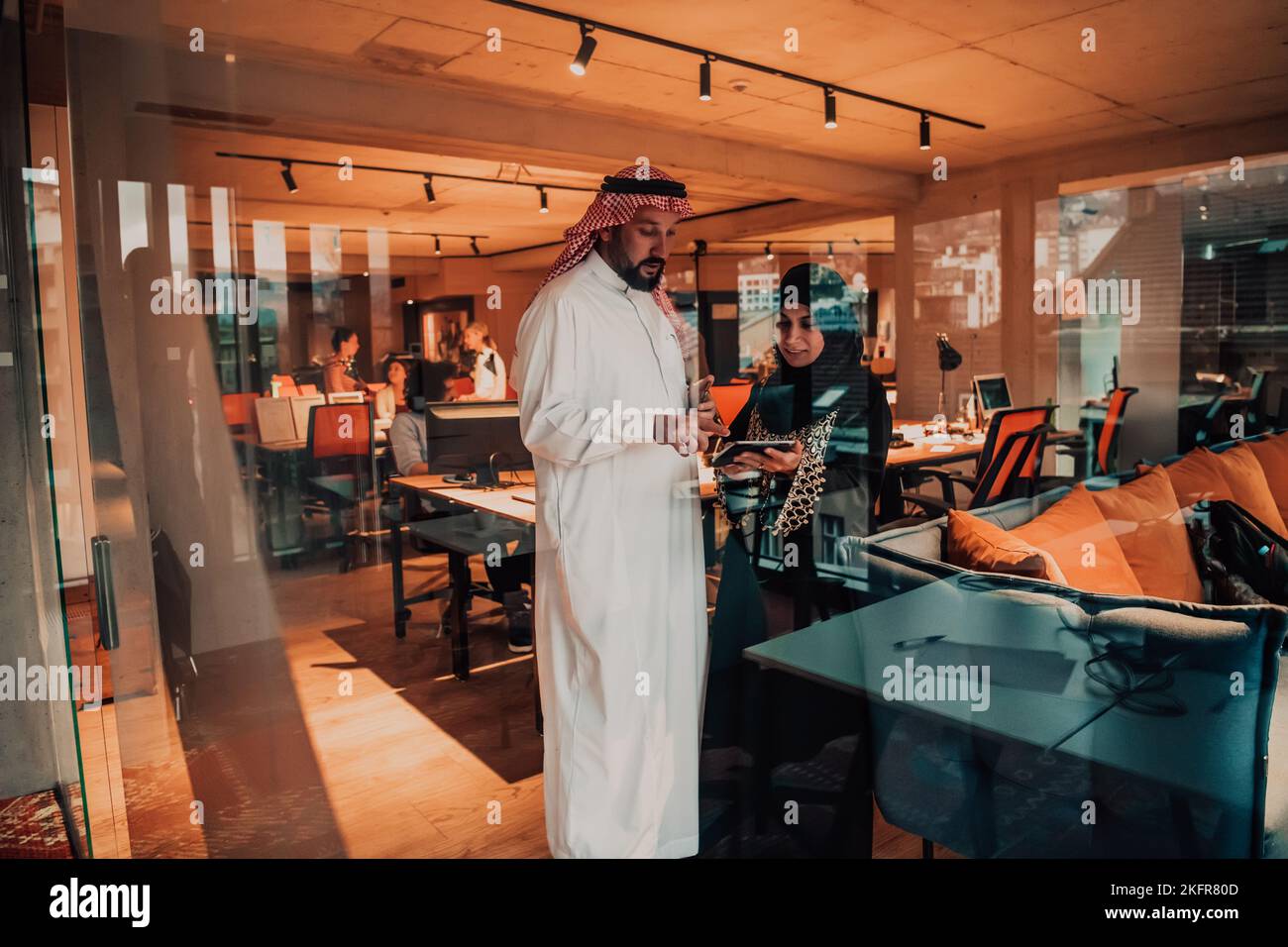 Portrait photo of Arab leader businessman with muslim hijab woman ...