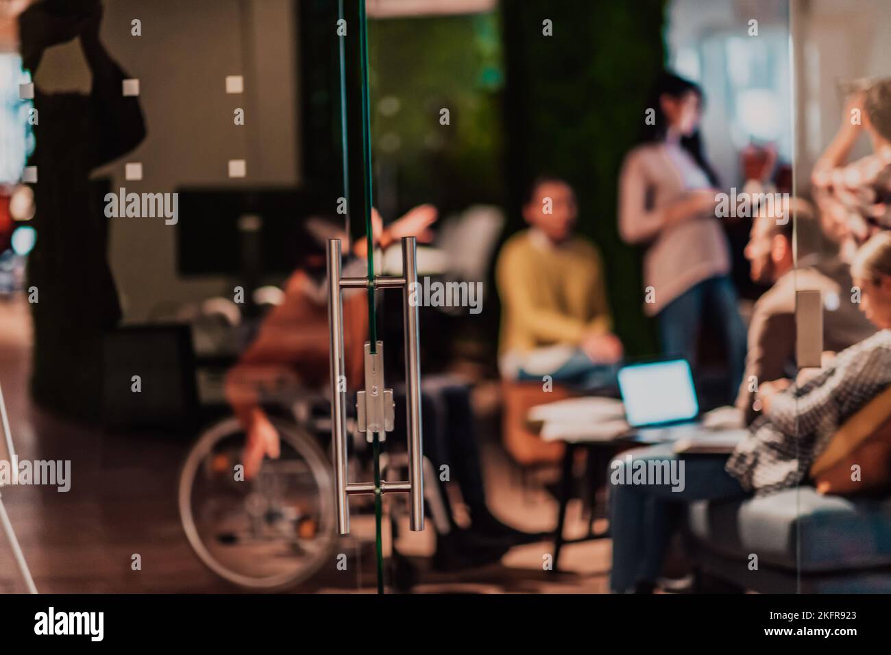 Business persons with a disability at work in modern open space ...