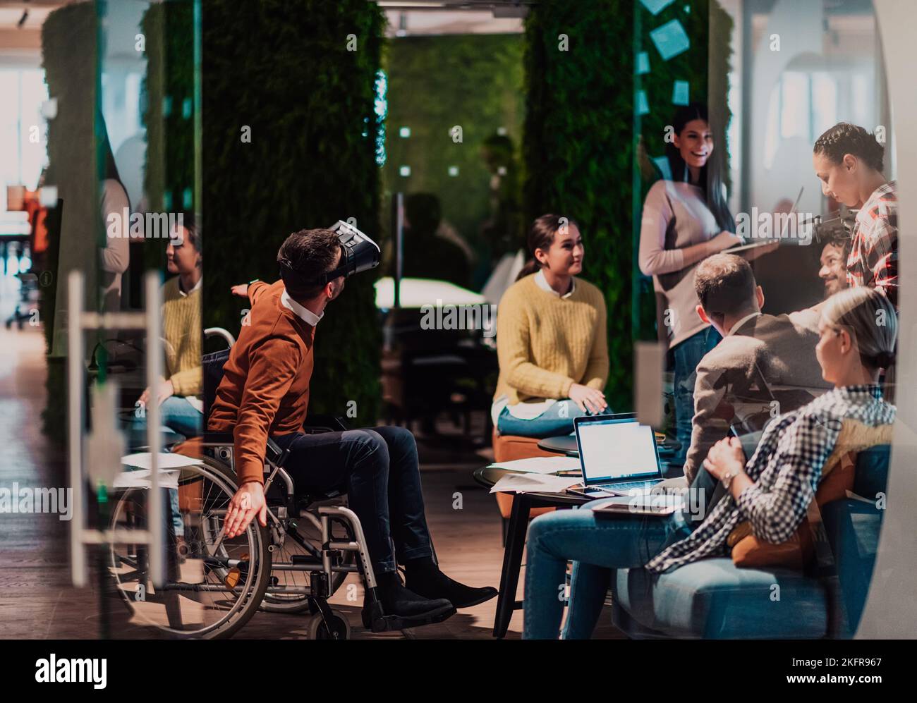 Business persons with a disability at work in modern open space ...