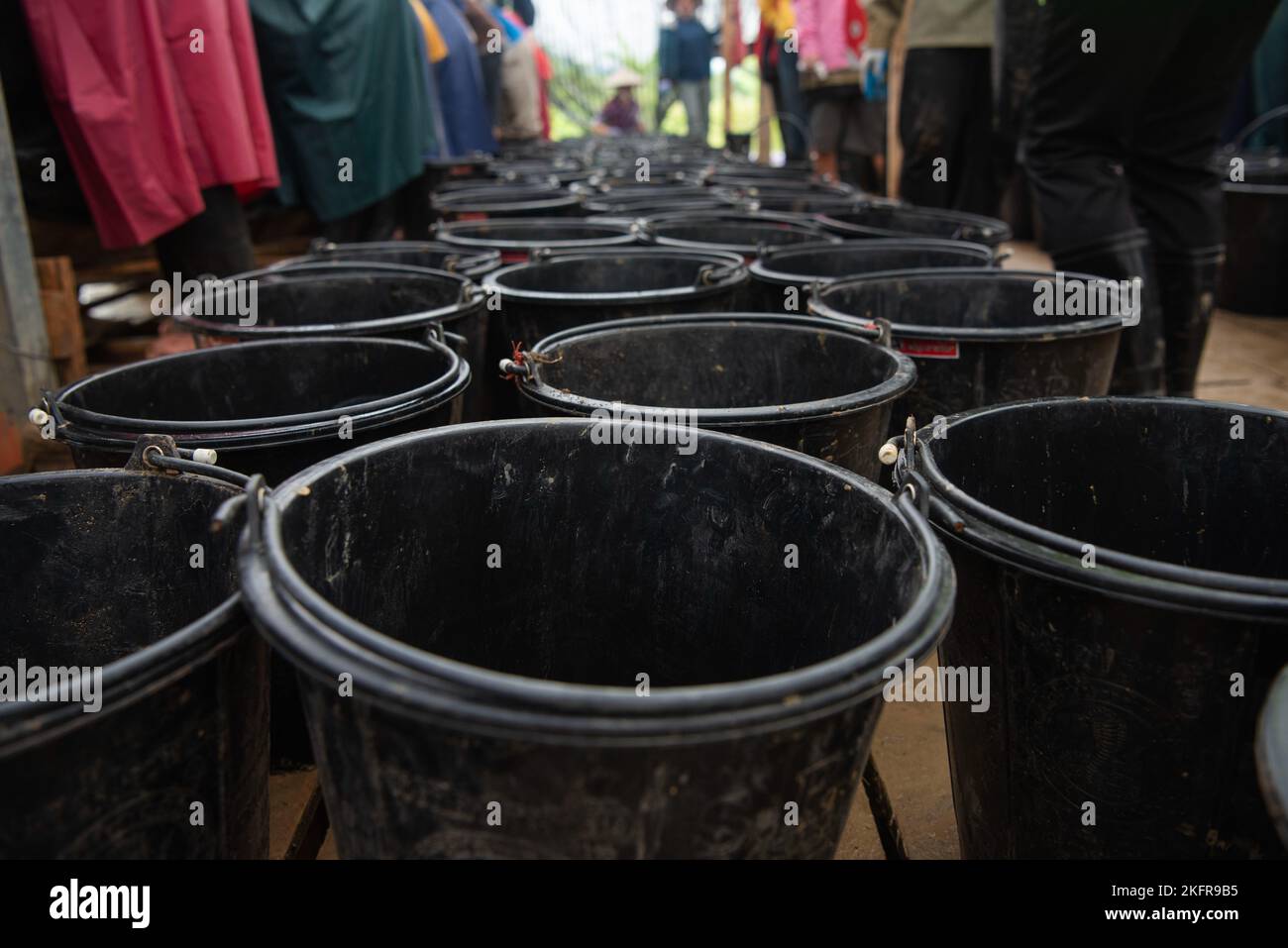 A row of buckets sit at a water screening station during a Defense POW ...