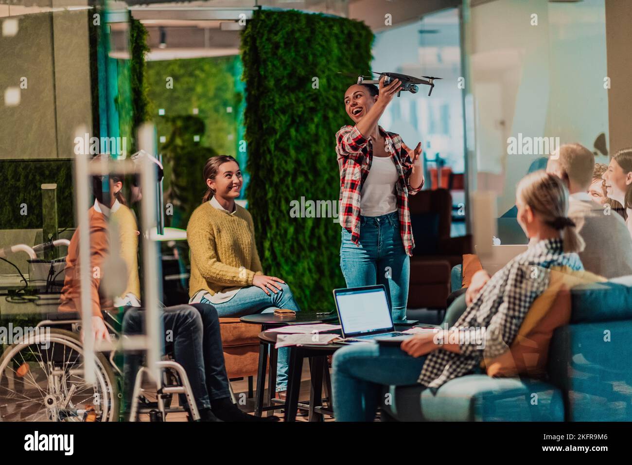 Business persons with a disability at work in modern open space ...