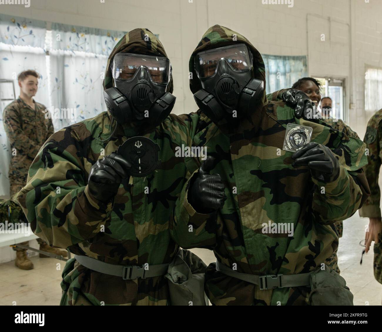 Japanese Ground Self-Defense Force Sgt. Takuya Ikeda, right, and ...