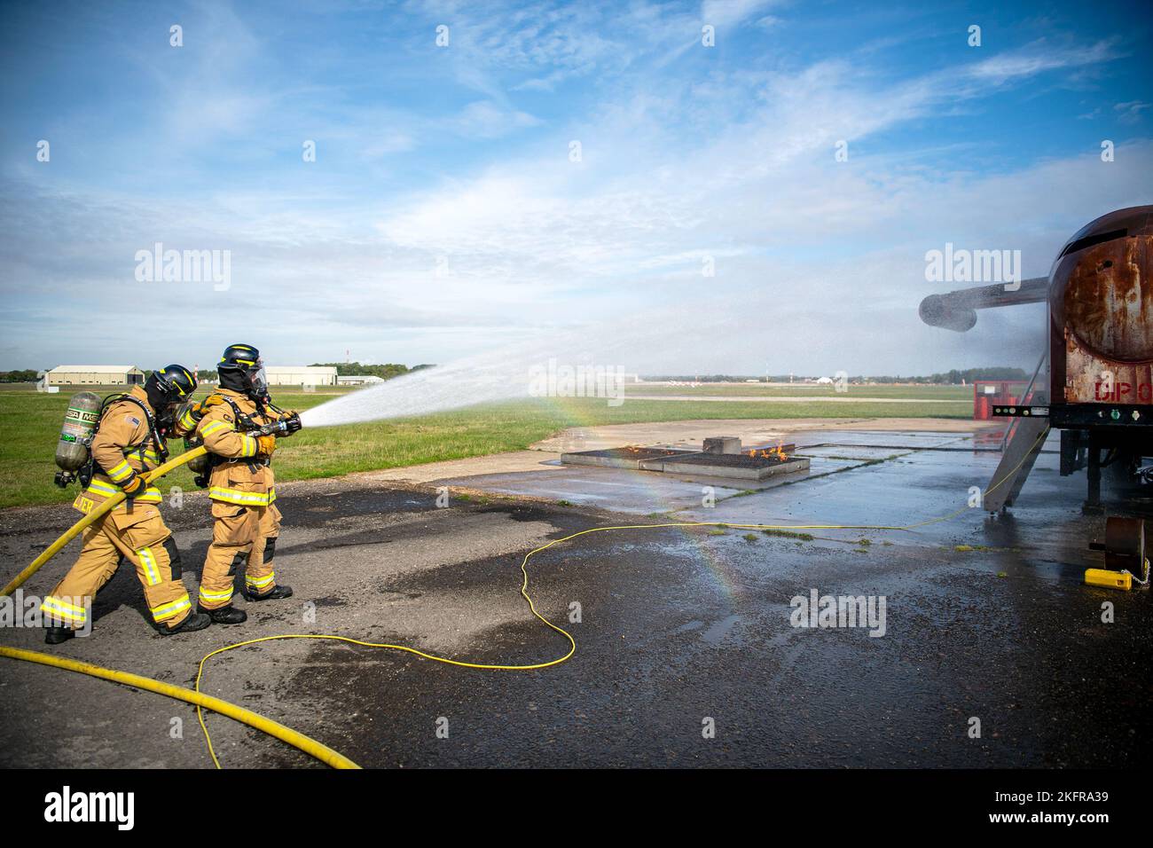 Firefighters from the 422d Fire Emergency Services extinguish an ...