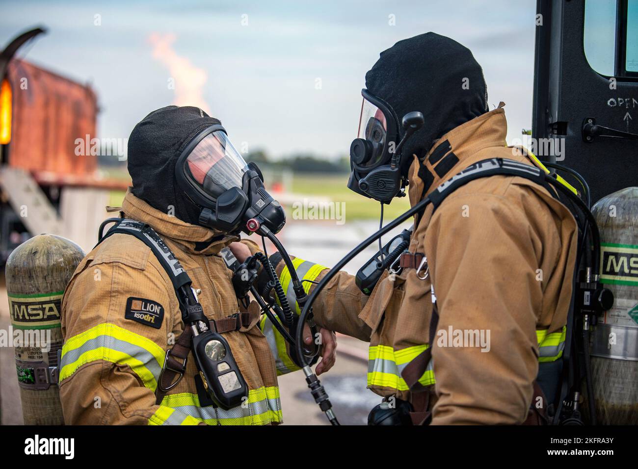 Firefighters from the 422d Fire Emergency Services perform buddy checks ...