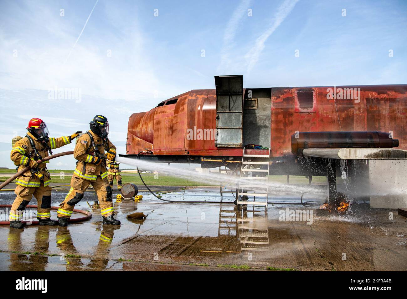 Firefighters from the 422d Fire Emergency Services extinguish an ...
