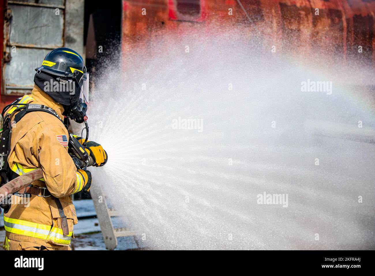 A firefighter from the 422d Fire Emergency Services extinguishes an ...