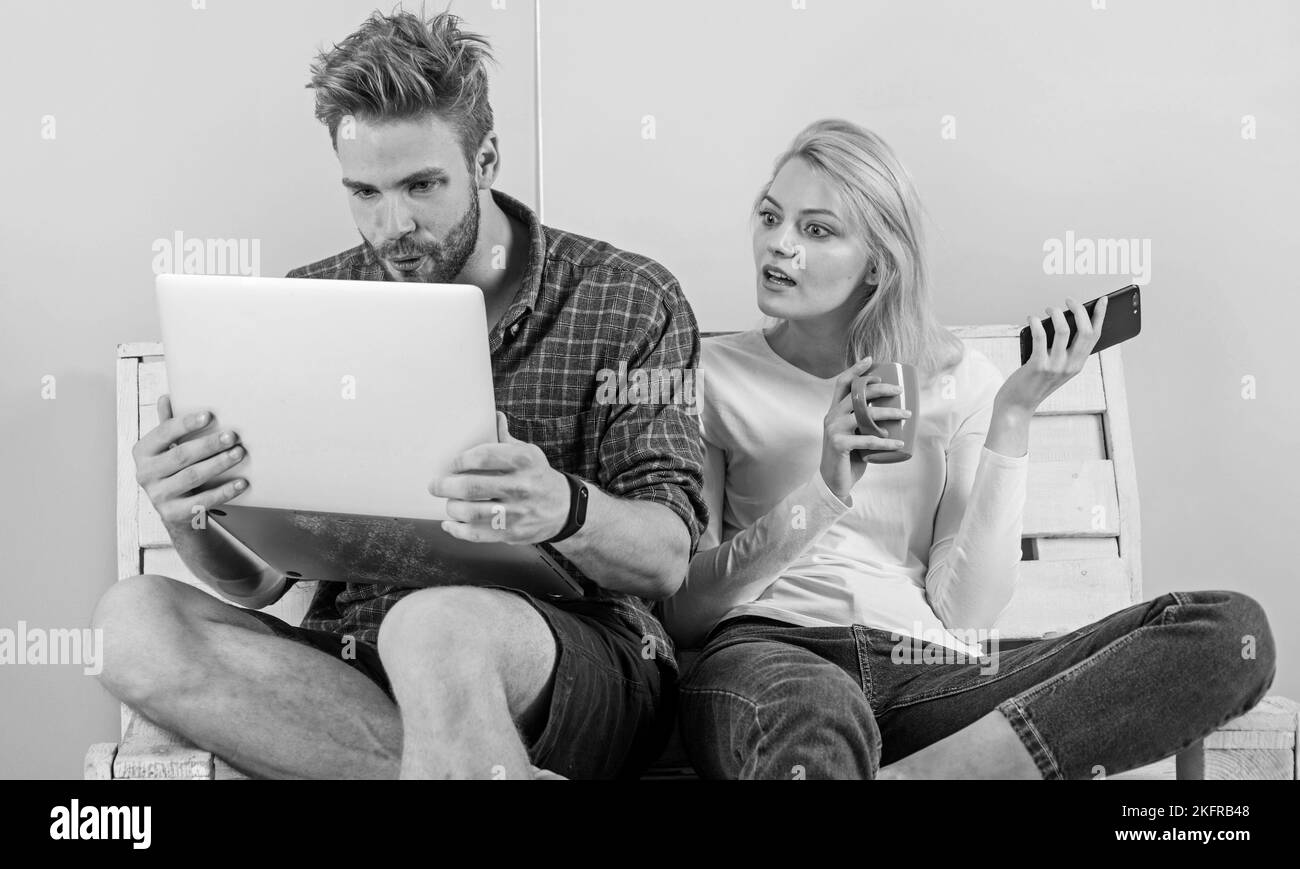 Couple surfing internet posting content social network. Shocking ...