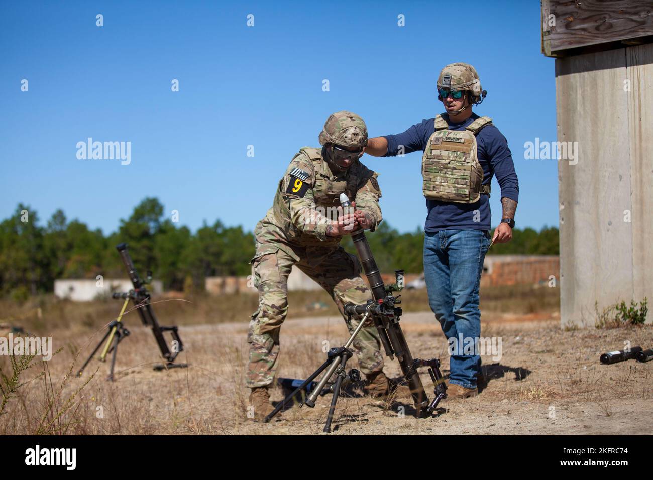 A competitor representing the U.S. Army Medical Command loads a M224 60 ...