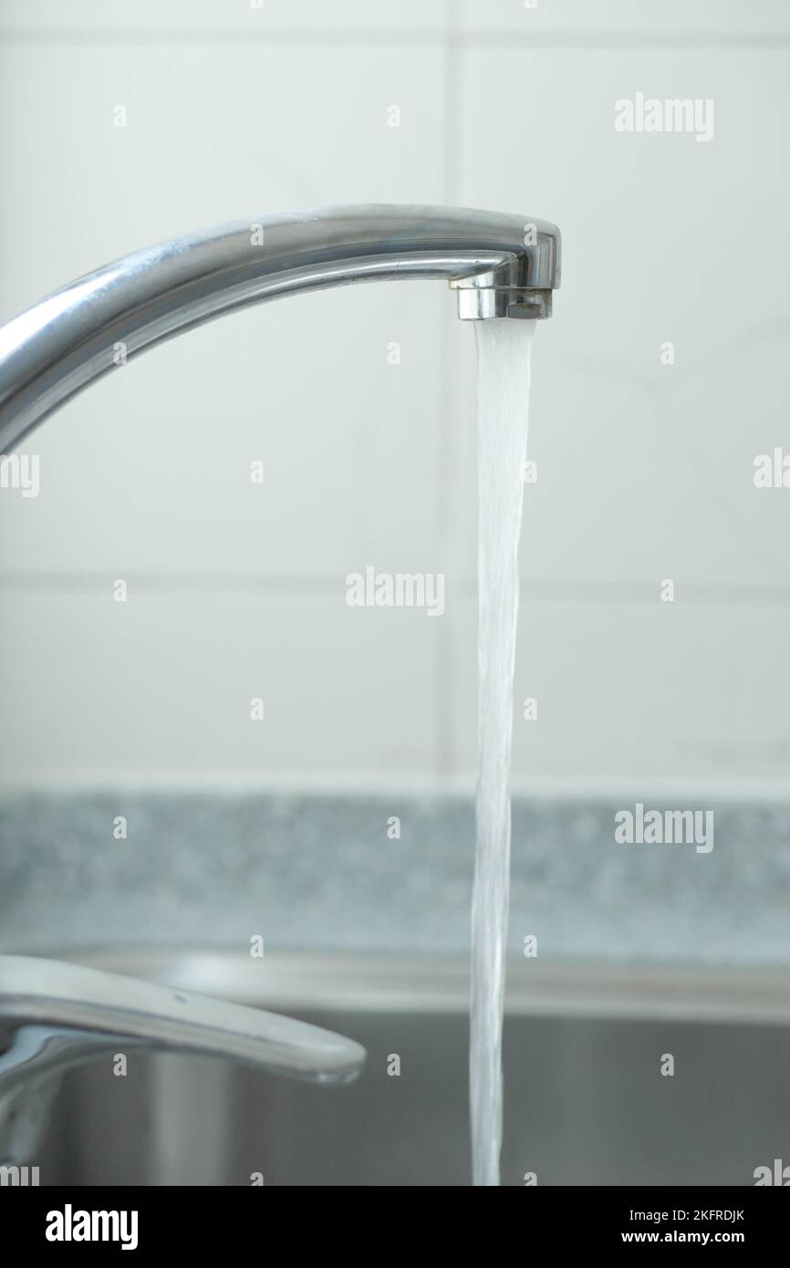 water pouring from a faucet tap slow motion Stock Photo - Alamy