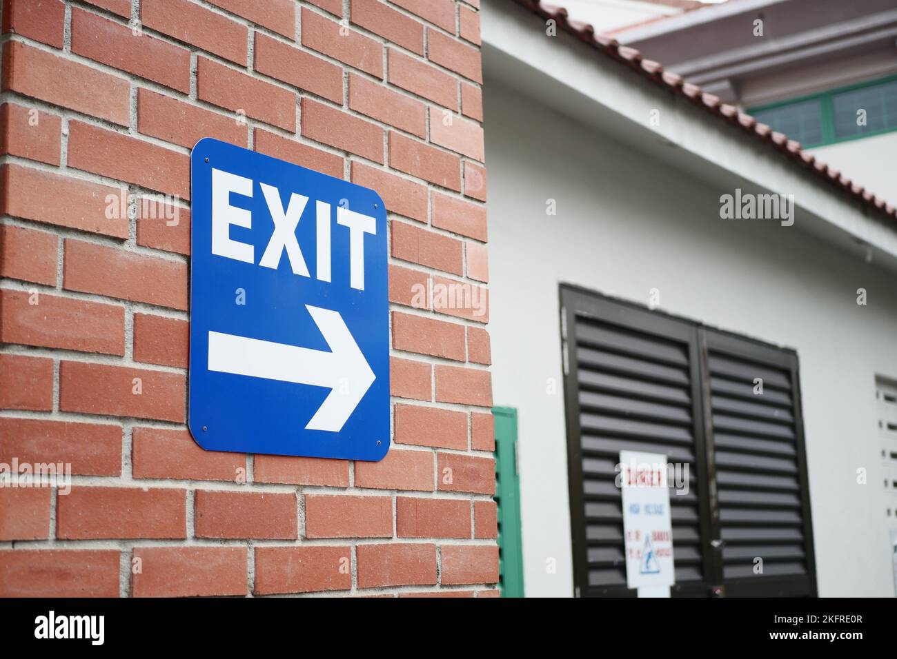 exit sign on brick wall Stock Photo - Alamy