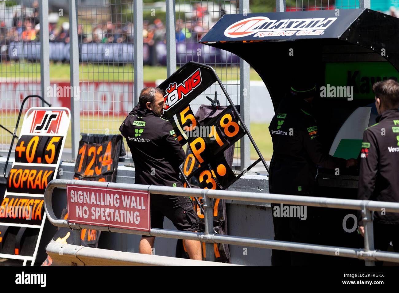 Phillip Island, Australia, 20 November, 2022. Team crews hold out Pit Boards for their riders ...