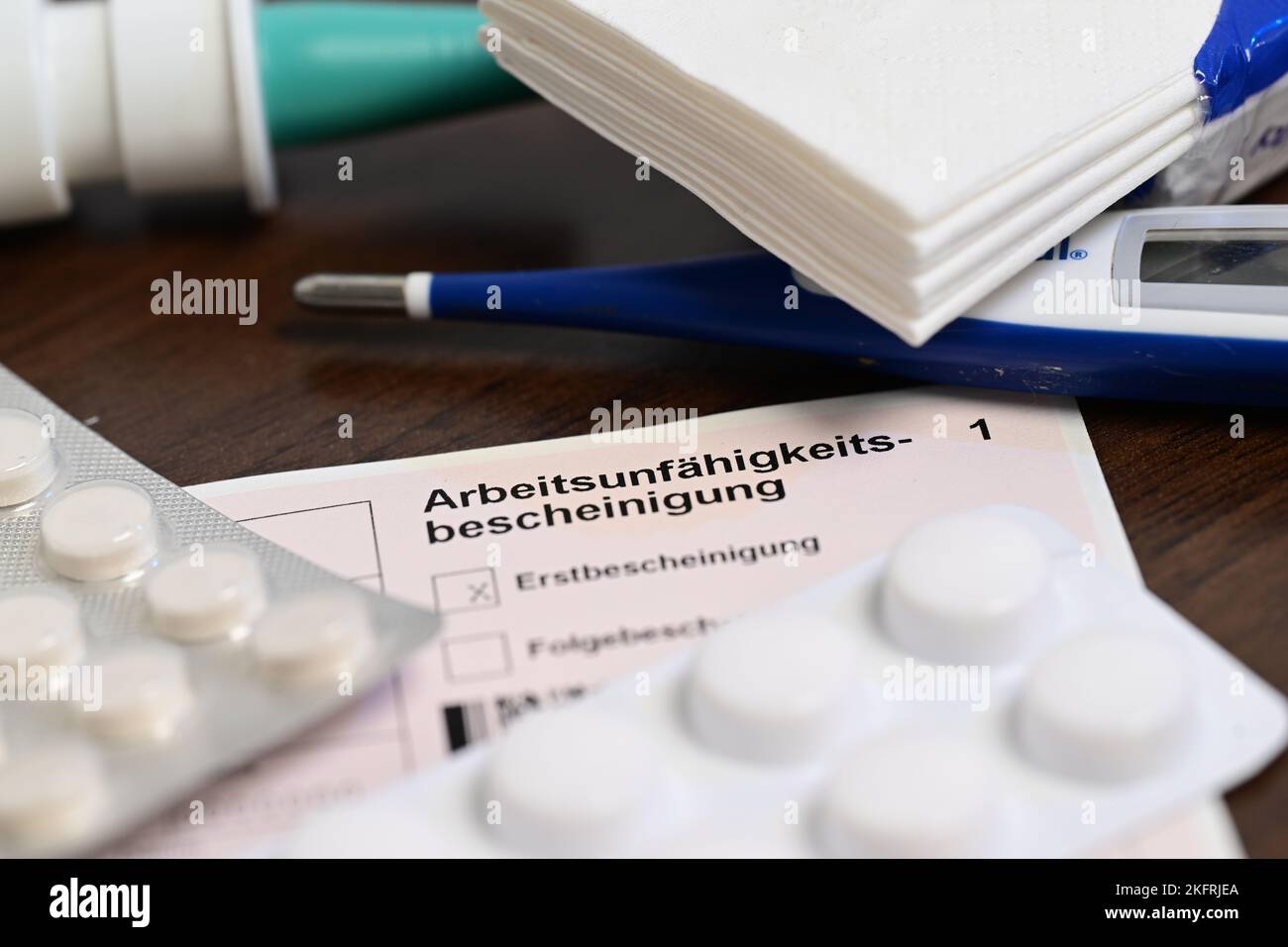 Stuttgart, Germany. 18th Nov, 2022. A fever thermometer, medication and ...