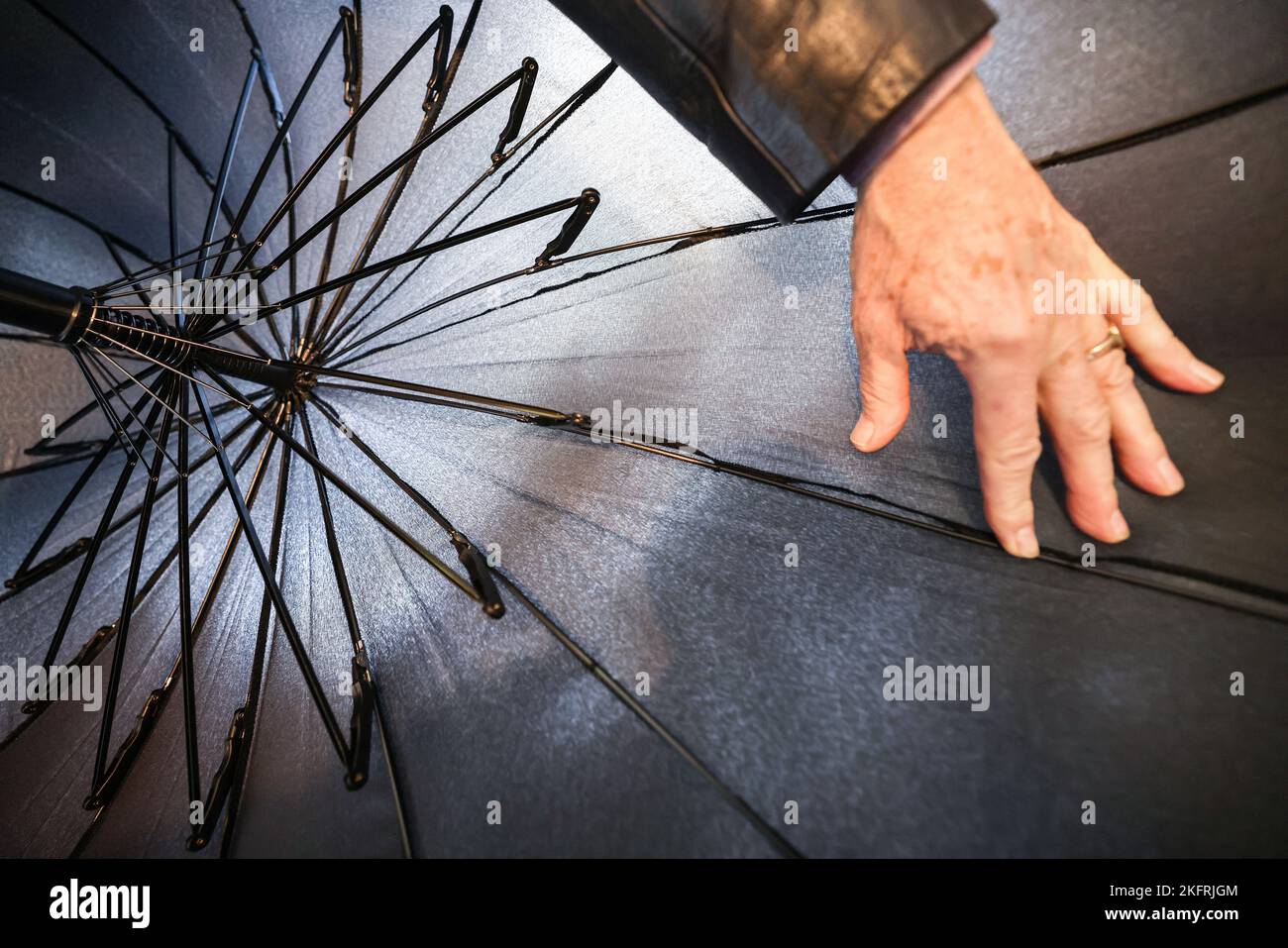 Essen, Germany. 18th Nov, 2022. Willy Schüffler, umbrella maker, shows ...