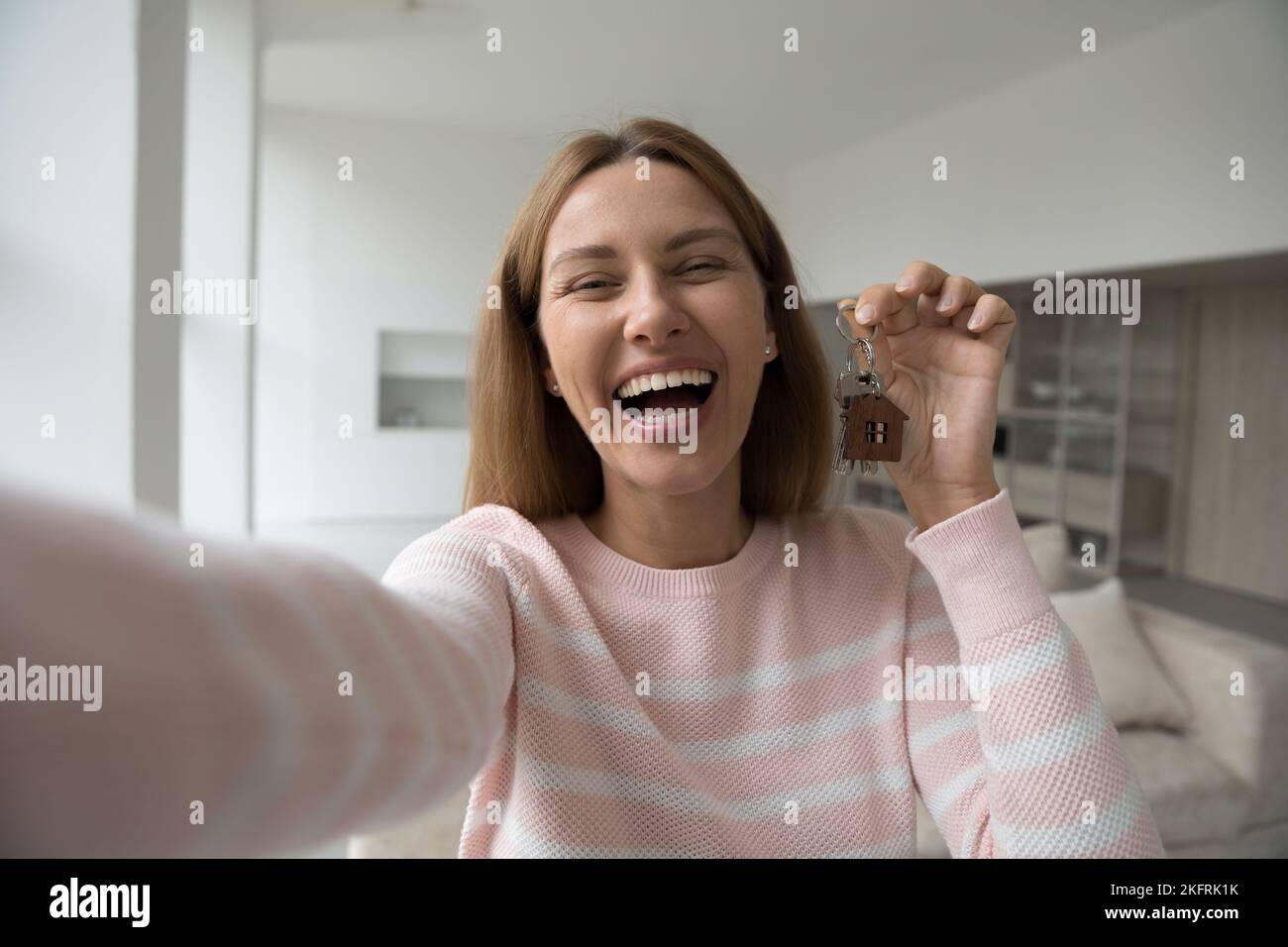 Headshot portrait happy woman showing bunch of keys on camera Stock ...