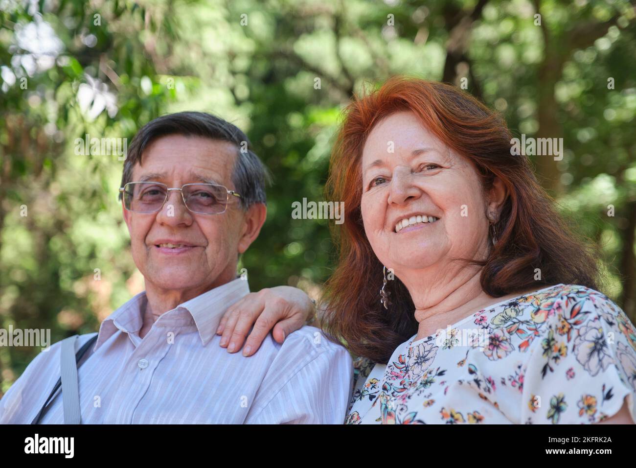 Senior Hispanic couple enjoying time together in a park, outdoors ...