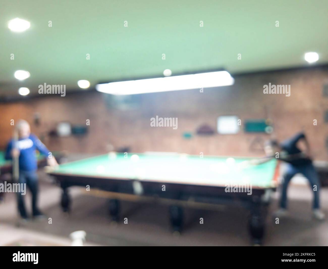 Blurred background men play billiards on table balls. Background ...