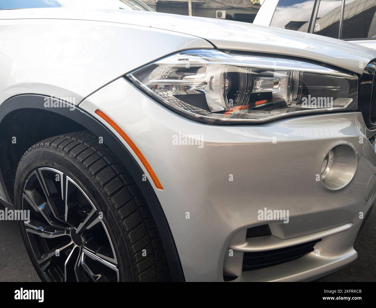 Modern car headlight of asilver luxury car close up. Headlight lamp of ...