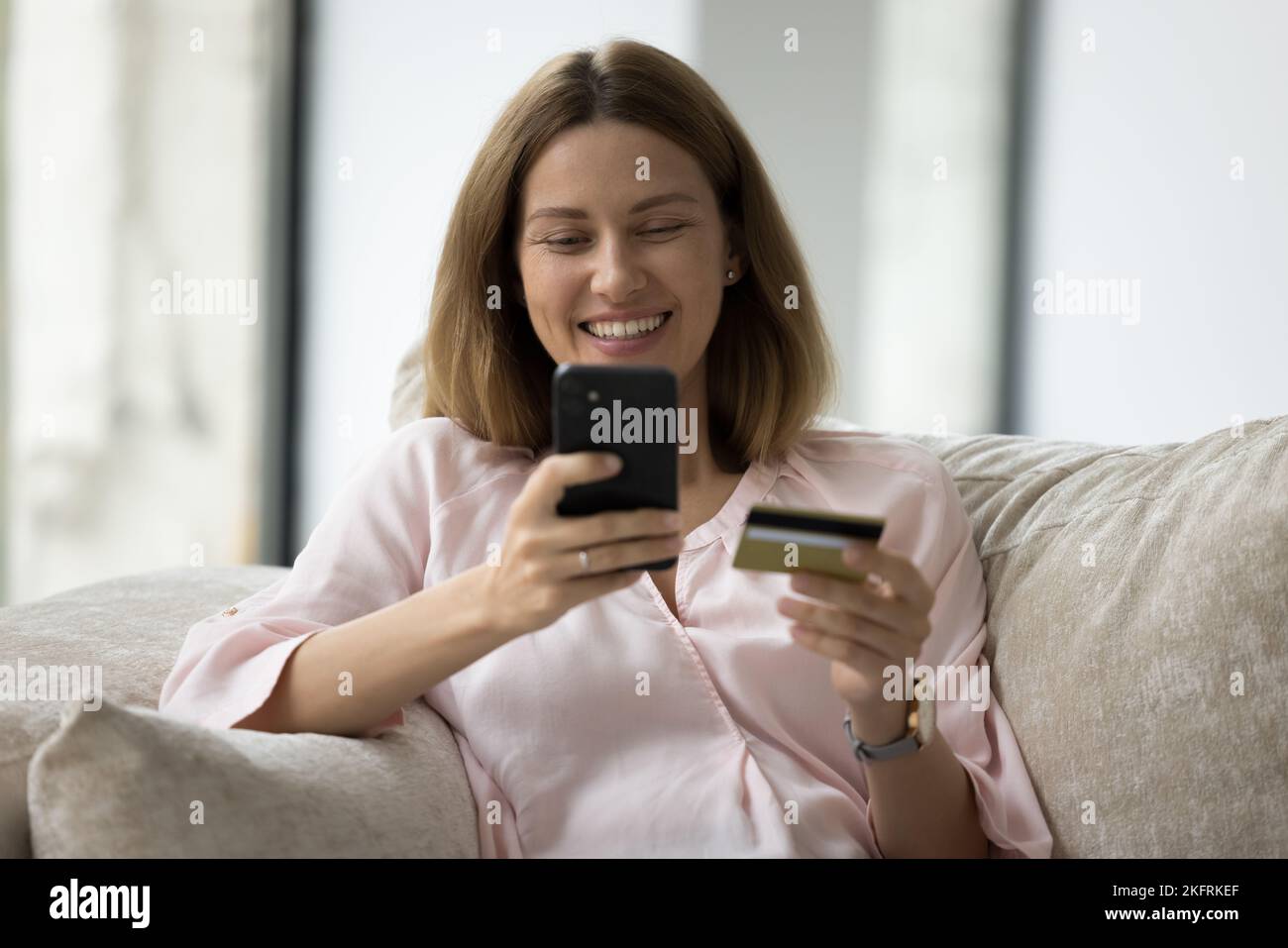 Woman use cellphone and credit card makes easy secure payments Stock Photo - Alamy