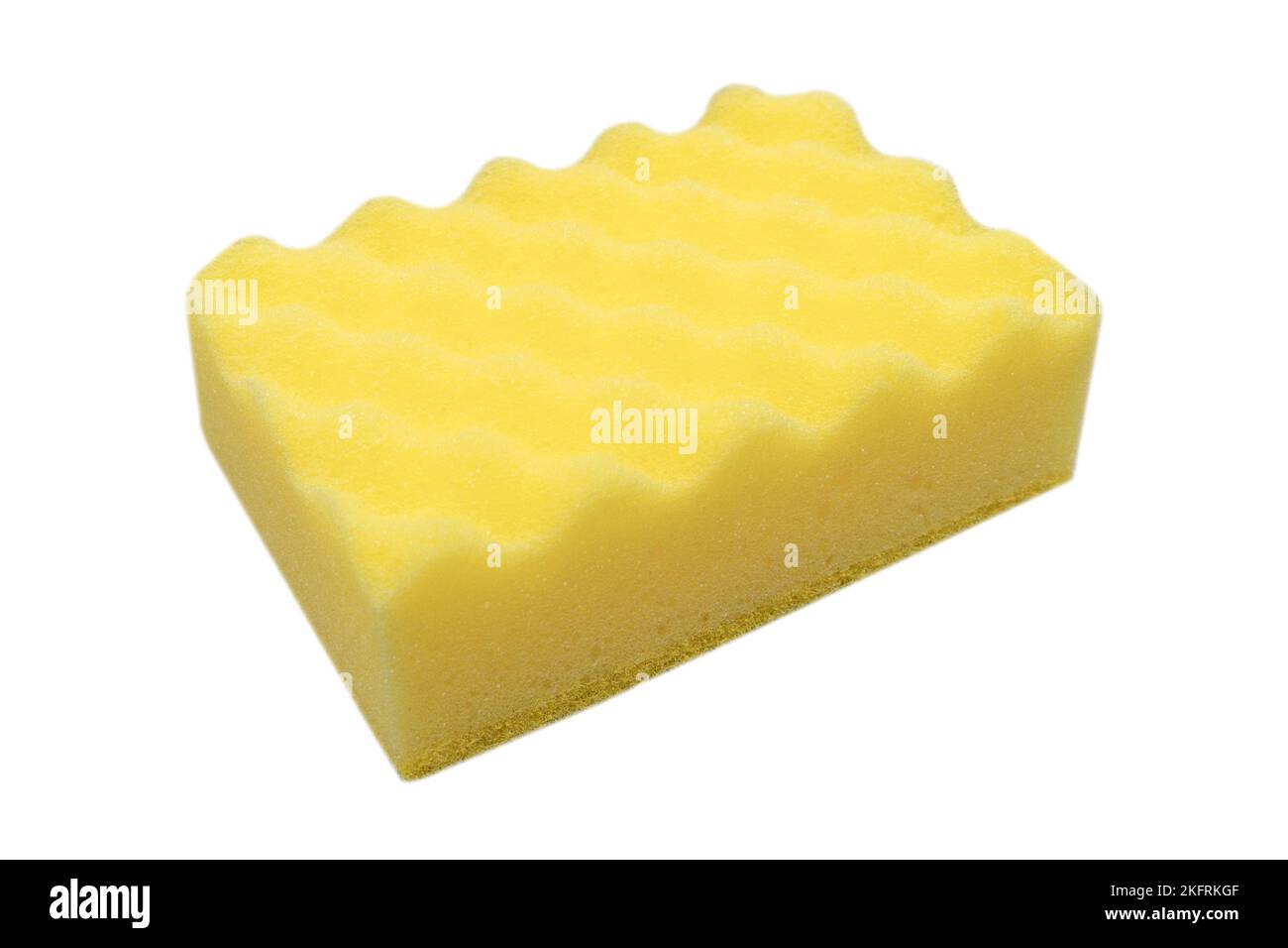 Macro shot of a surface of yellow sponge isolated onwhite background ...