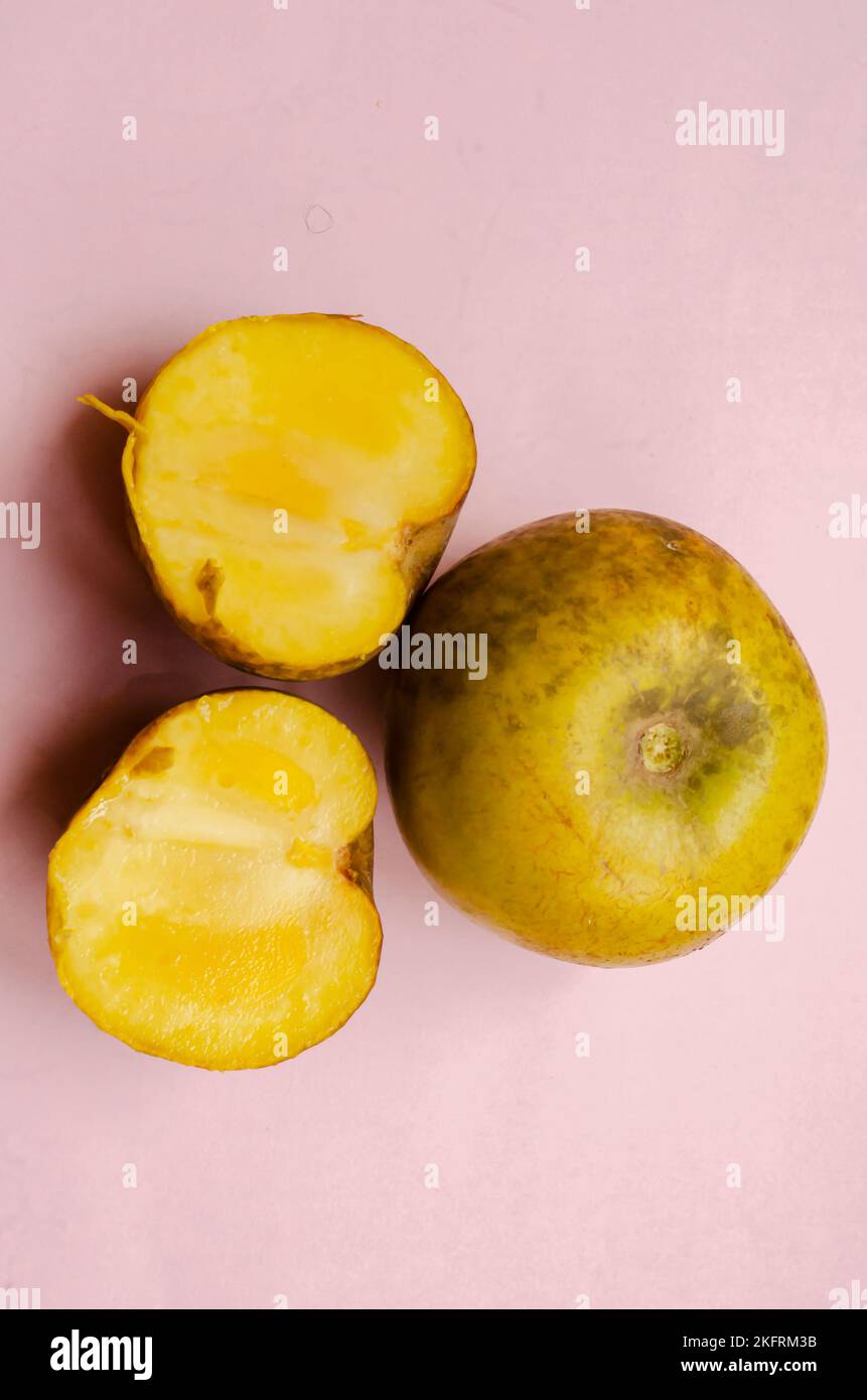 One and Two Halves White Sapote Fruits Stock Photo - Alamy